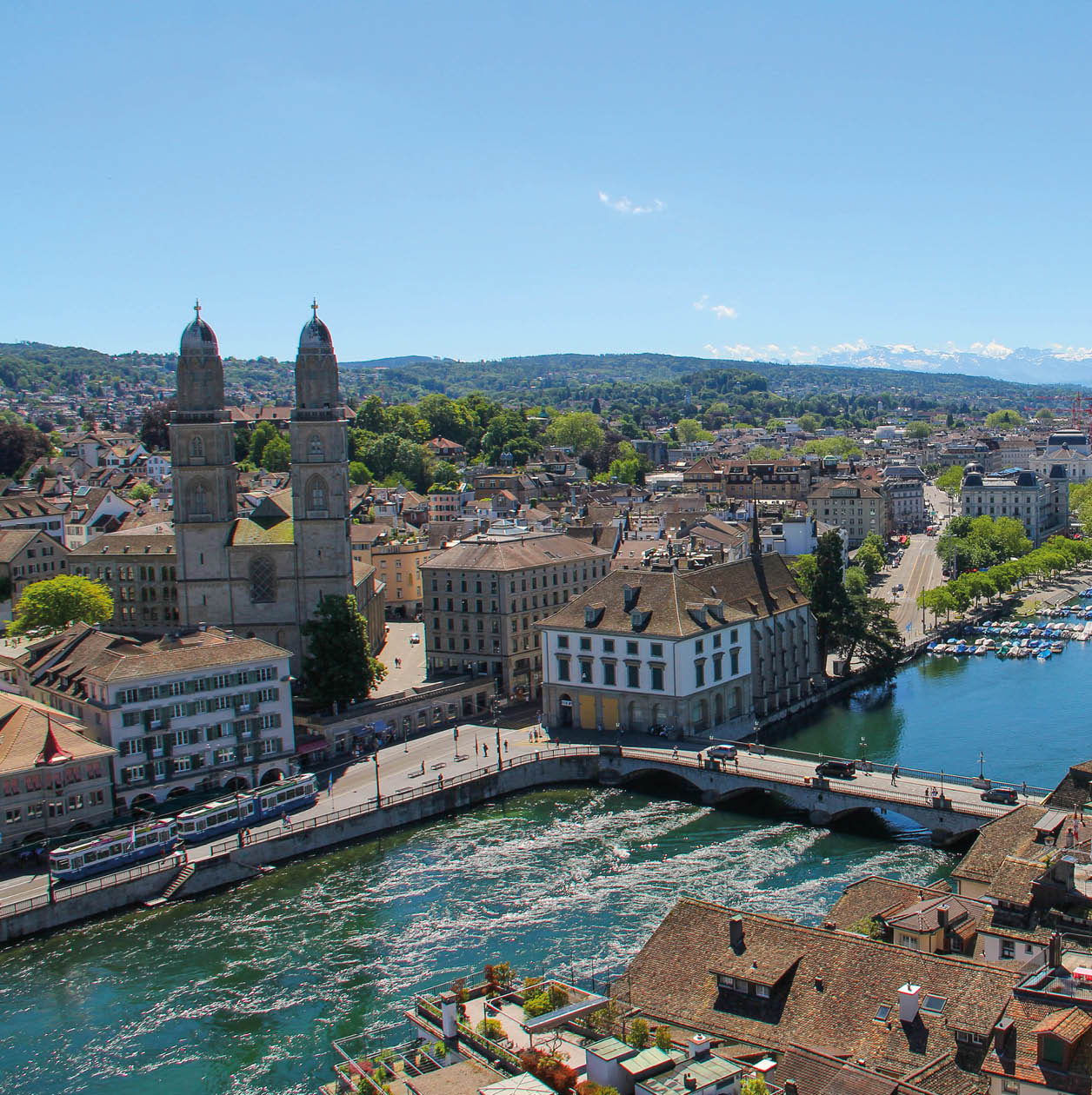 A view of the city centre of Zurich and the surrounding mountains.