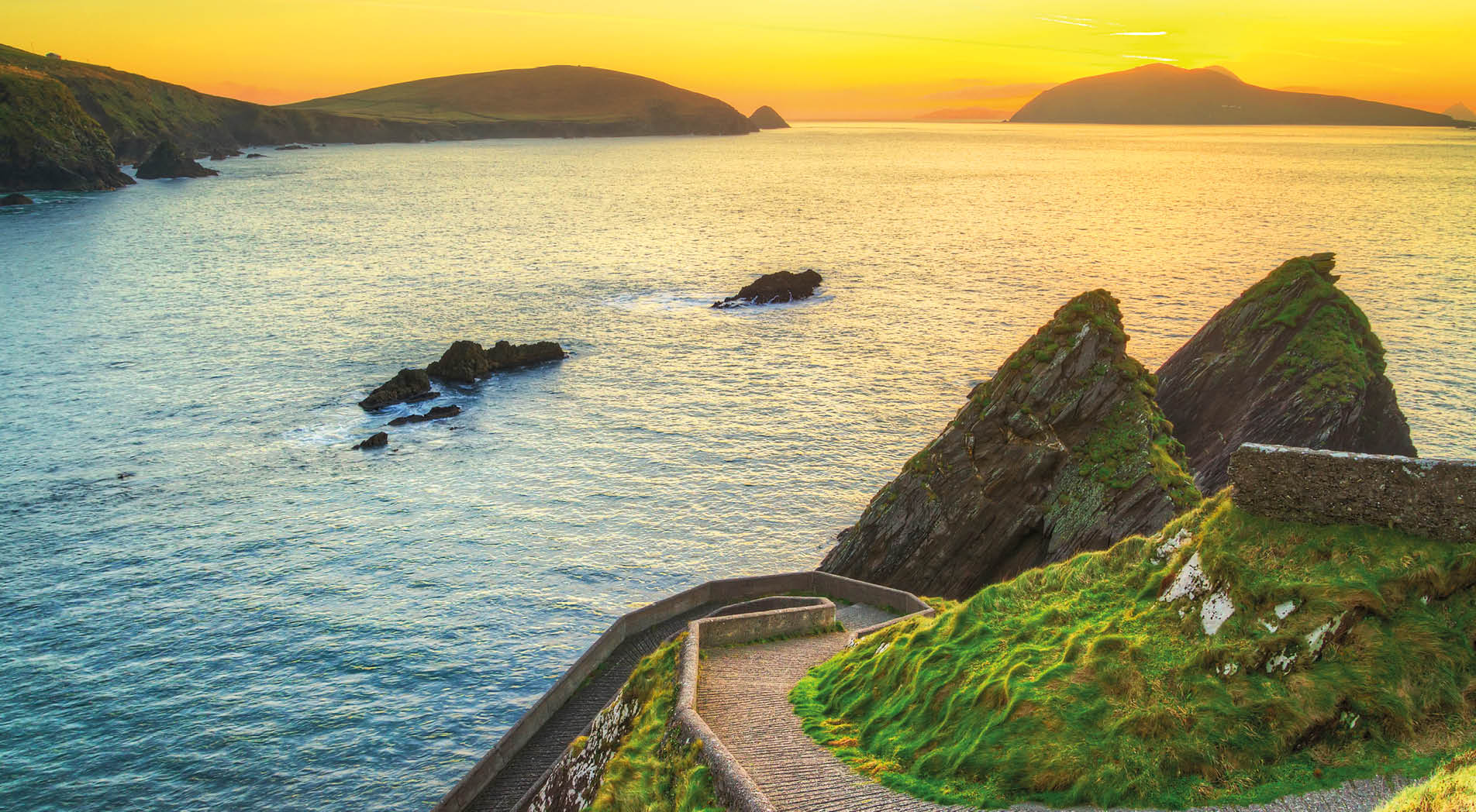 Sunset over pathway leading to Dunquin Pier on Dingle Peninsula, Co ...